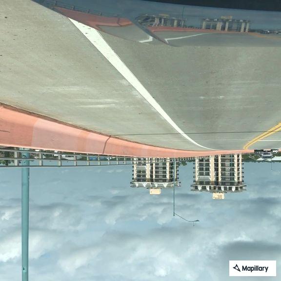 Woman throwing items over eastbound causeway bridge, New Smyrna Beach ...