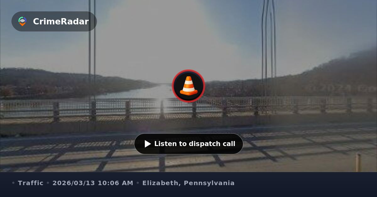 Flatbed truck hauling car with hood open on bridge, Elizabeth PA ...