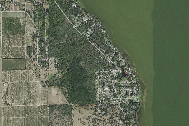 Small smoldering wood pile controlled behind house, Lake Wales FL ...