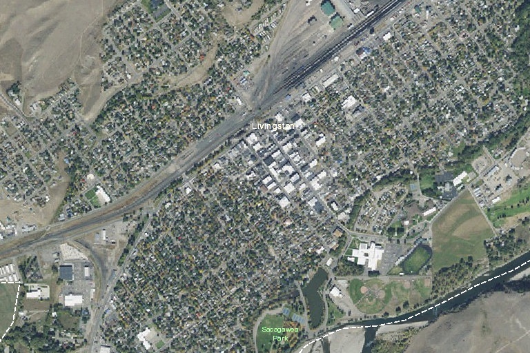 Sparking power line contacts tree behind Main St building, Livingston ...